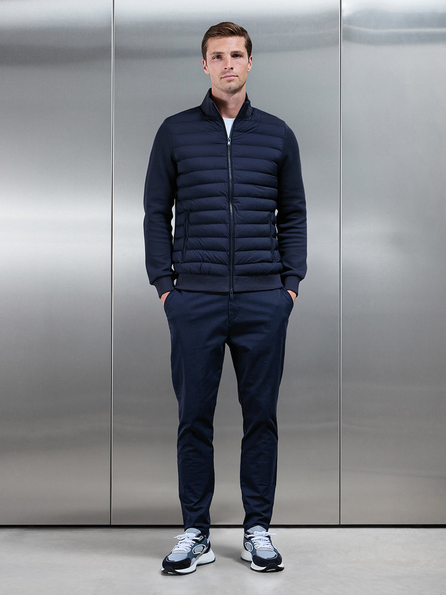 Hybrid Quilted Technical Funnel Neck Jacket in Navy | ARNE US