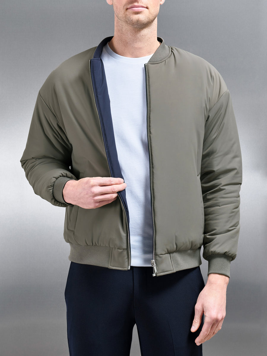 Relaxed Padded Reversible Bomber Jacket in Olive Navy ARNE